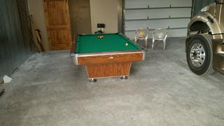 We installed a 9' Top Line pool table in a very nice garage / workshop ...